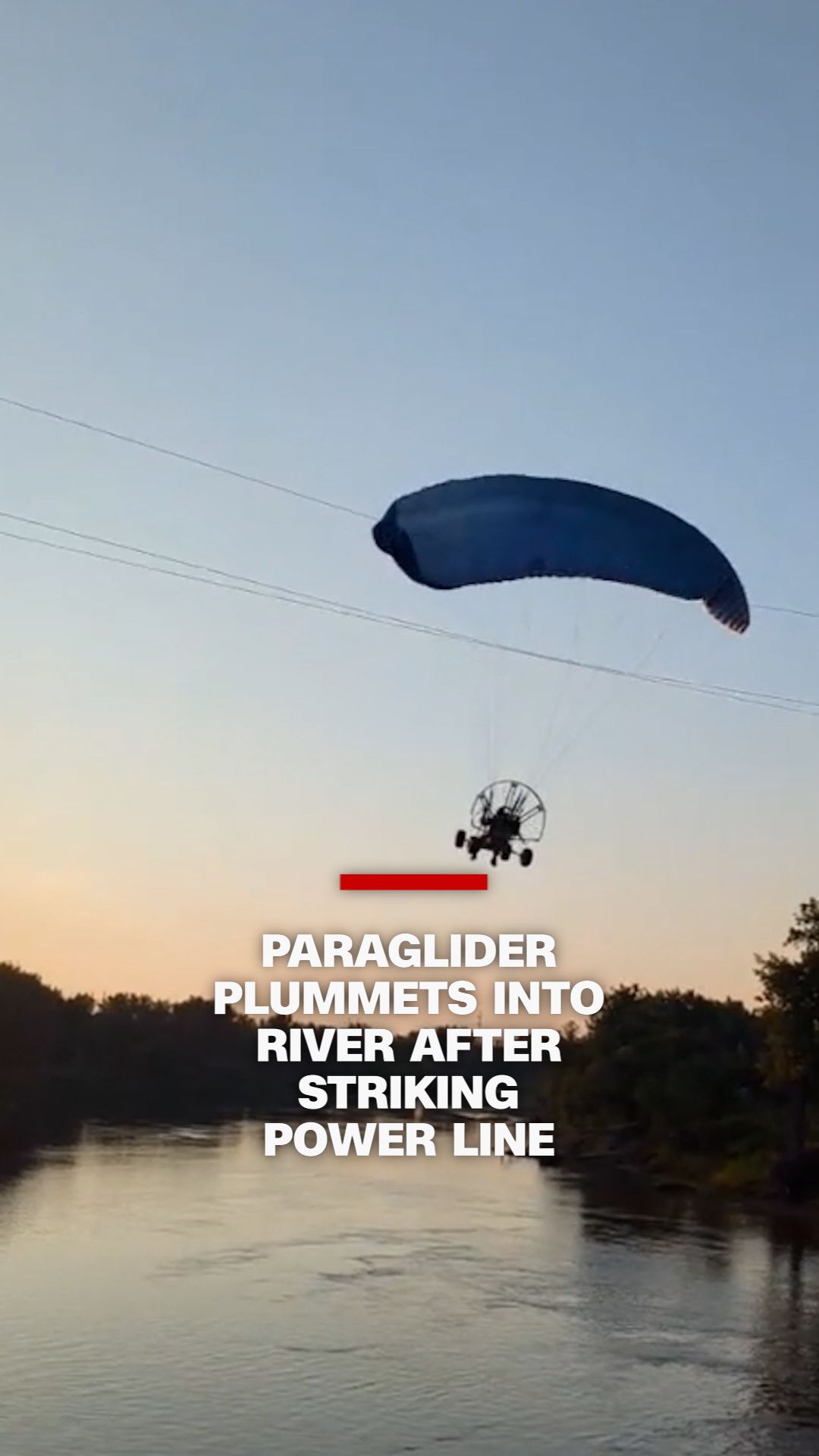 Paraglider plummets into river after striking power line | CNN
