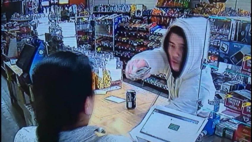 Cashier fights off armed robber | CNN
