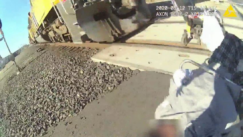 See the moment officer saves man in wheelchair from train | CNN See the moment officer saves man in wheelchair from train | CNN