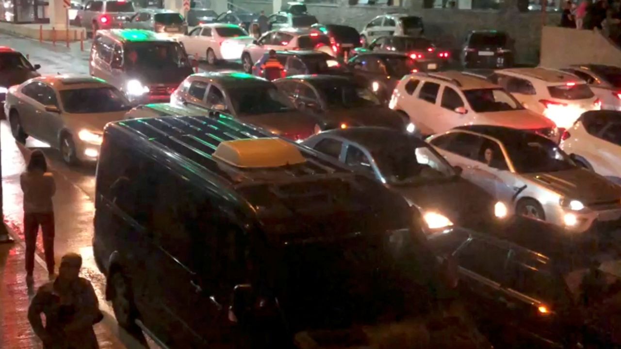 Traffic Jams And Desperation At The Border As Russians Flee Putins