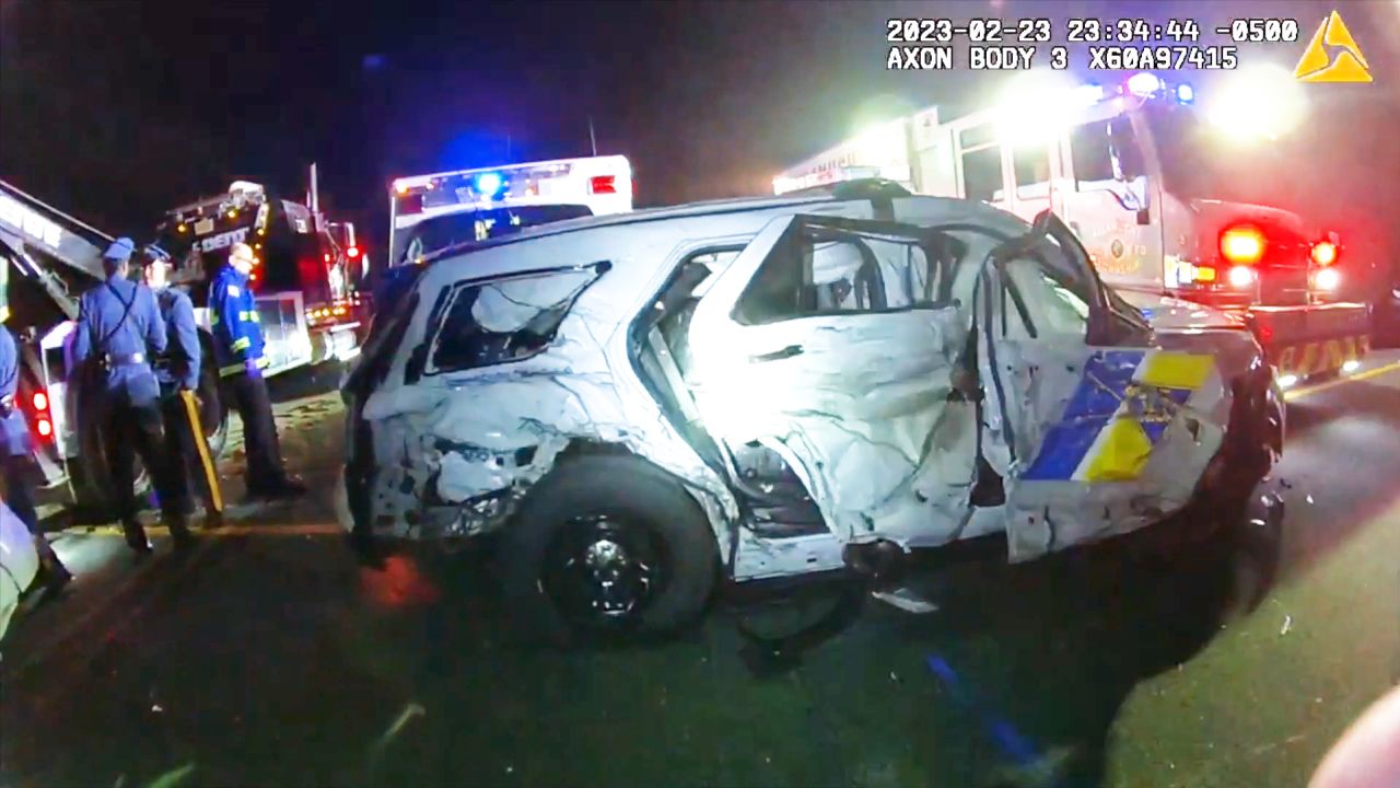 Video Shows Massive Tractor Trailer Plow Into Police Cars At Highway