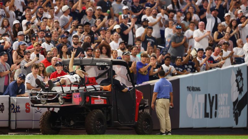 Cameraman carted off the field after getting hit by throw in Yankees game; is ‘conscious’ and ...